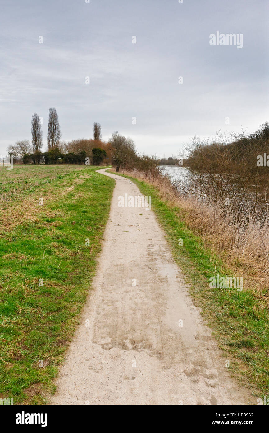 A rough track running alongside the River Trent and fields Stock Photo ...