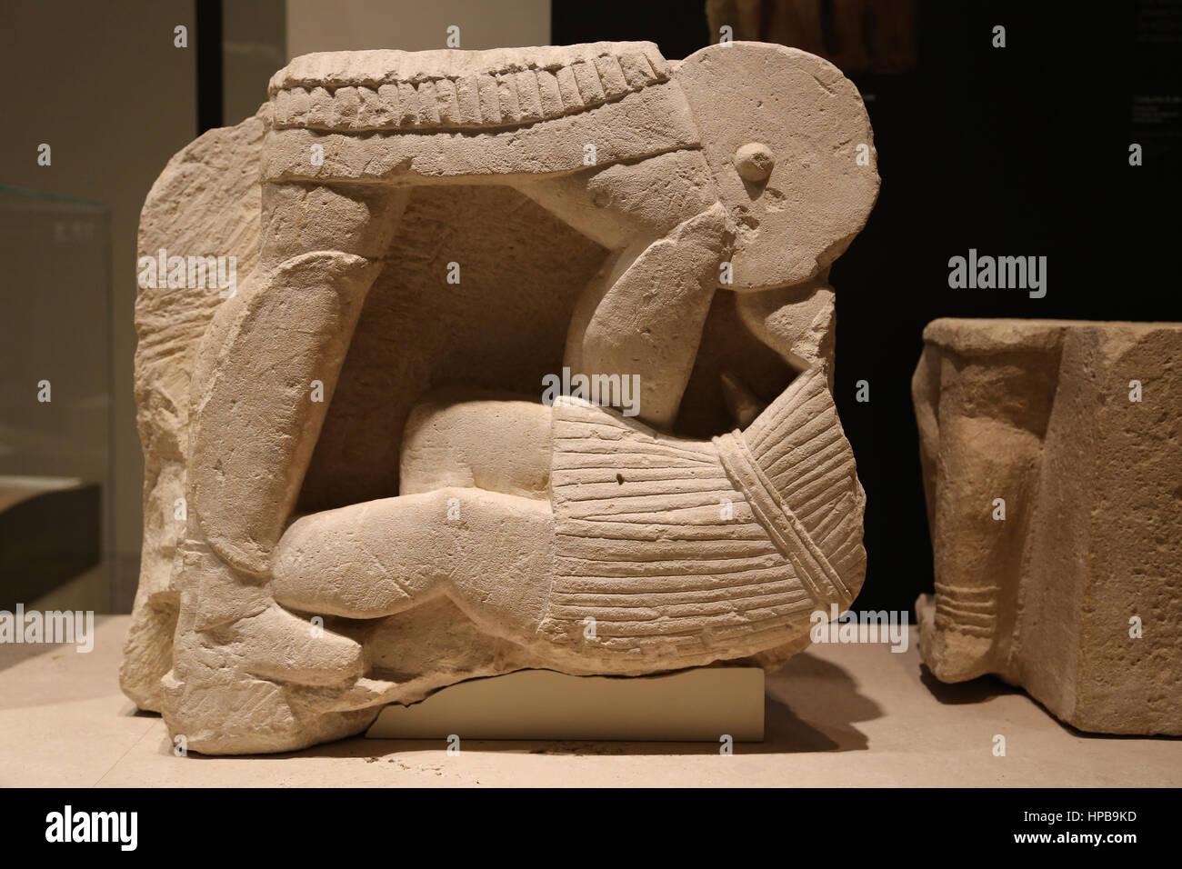 Iberian ashlars. Osuna group B. Fallen Iberian warrior holding a caetra ...