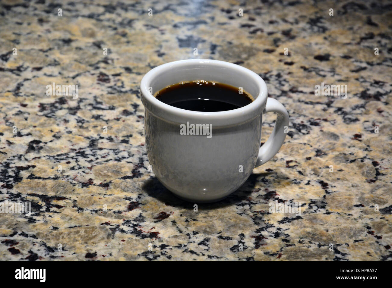 Cup of coffee on the kitchen counter Stock Photo - Alamy