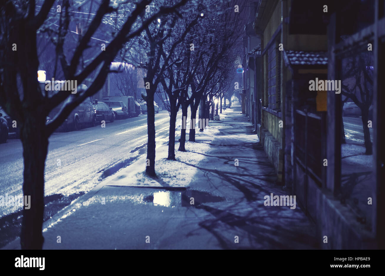 Outdoors of small Balkan town during winter, night scene. Cacak city ...