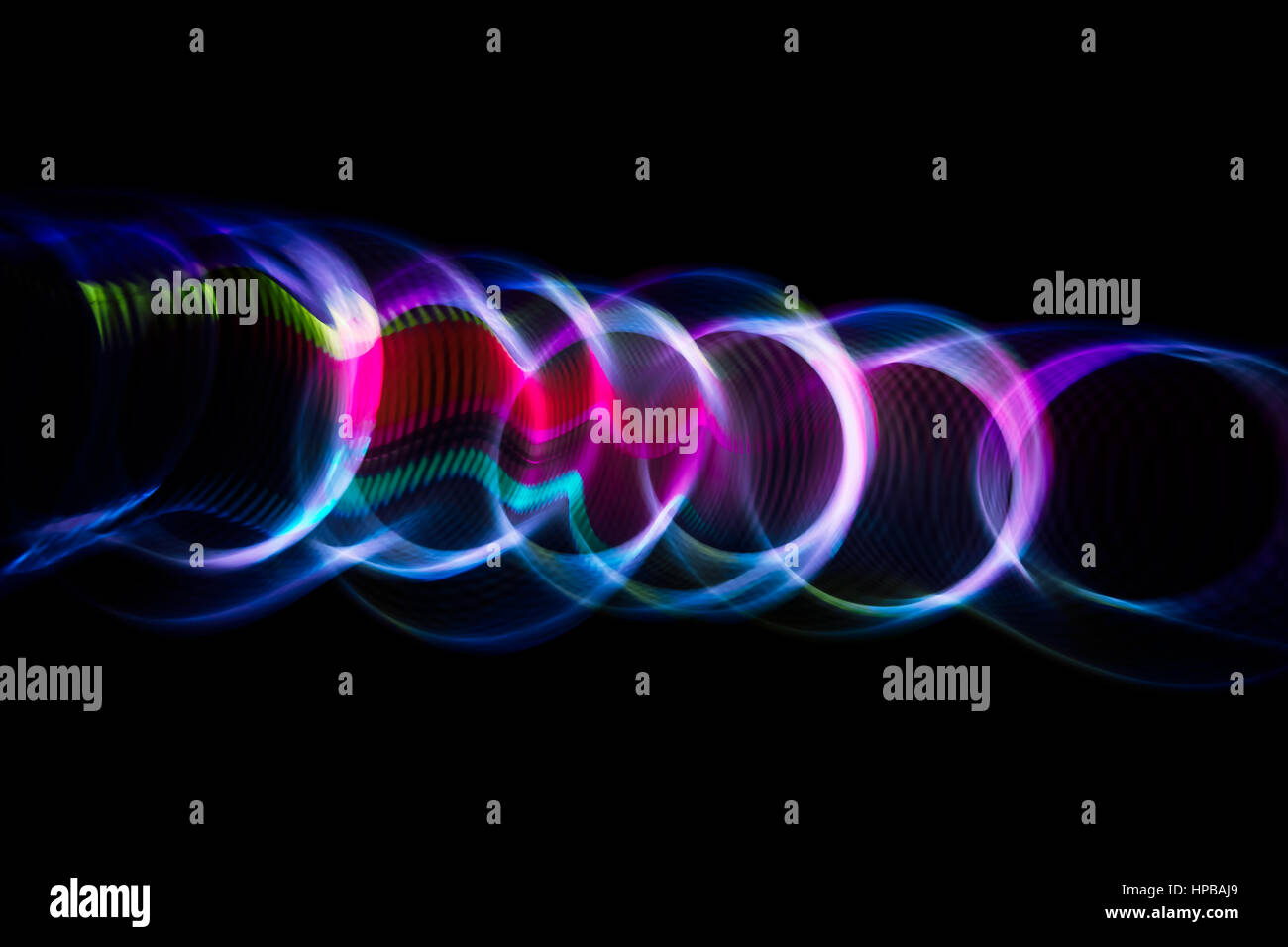 Sound waves in the visible blue color in the dark Stock Photo - Alamy