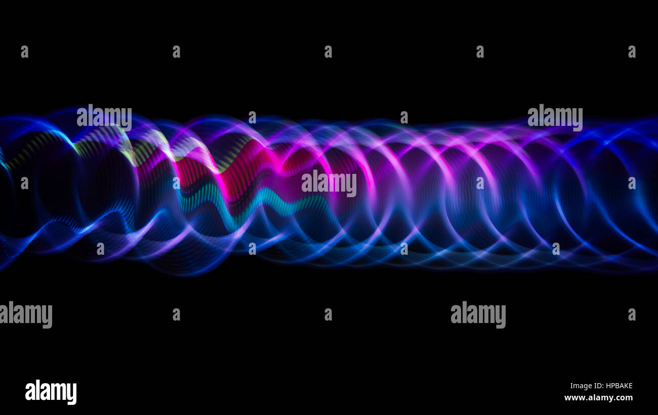 Sound waves in the visible blue color in the dark Stock Photo - Alamy