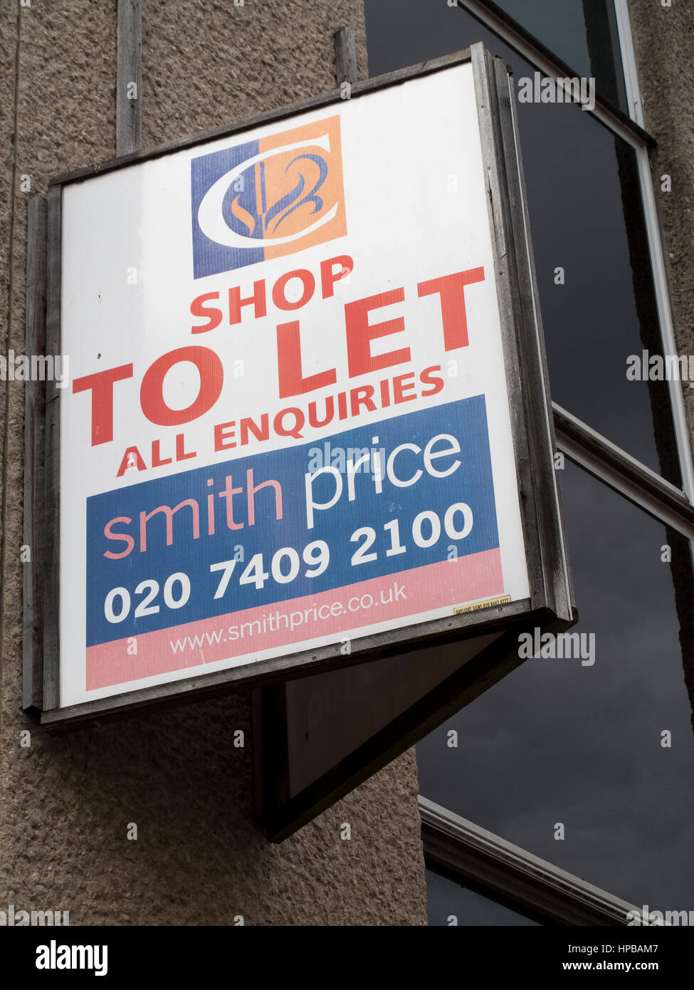 Commercial vacant shop to let sign over retail unit Stock Photo - Alamy