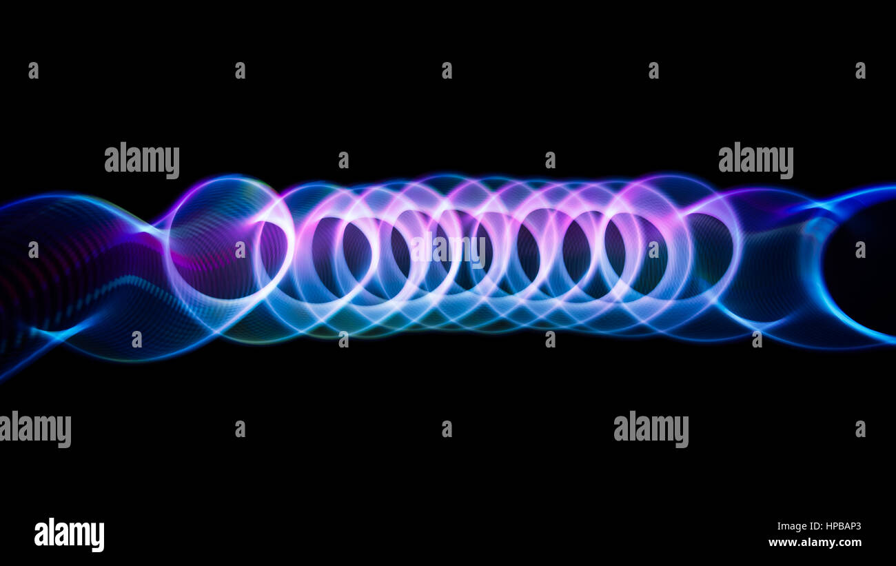 Sound waves in the visible blue color in the dark Stock Photo - Alamy