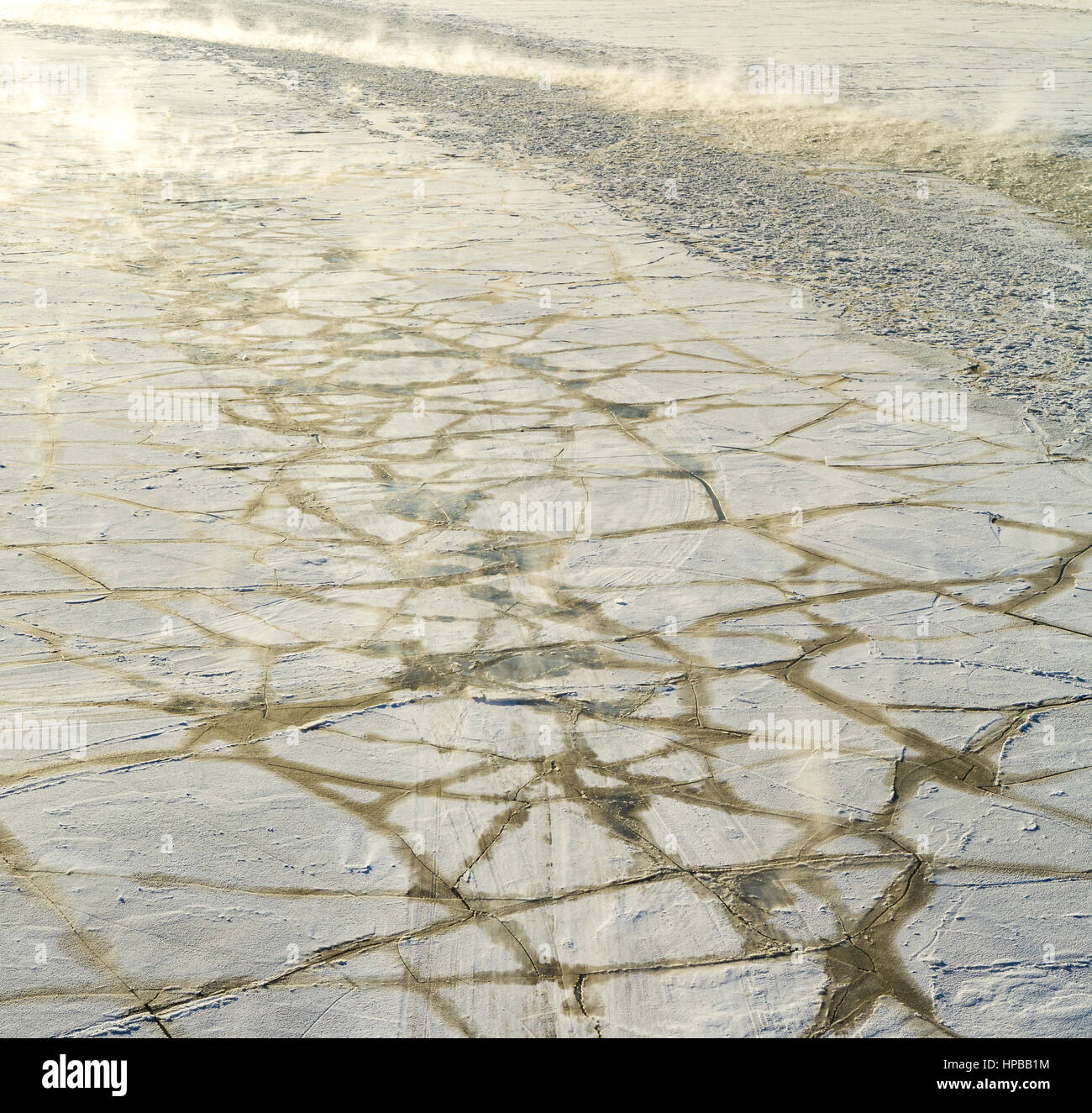 Frozen, covered with ice floes Moskva River, back lit photo in cold ...