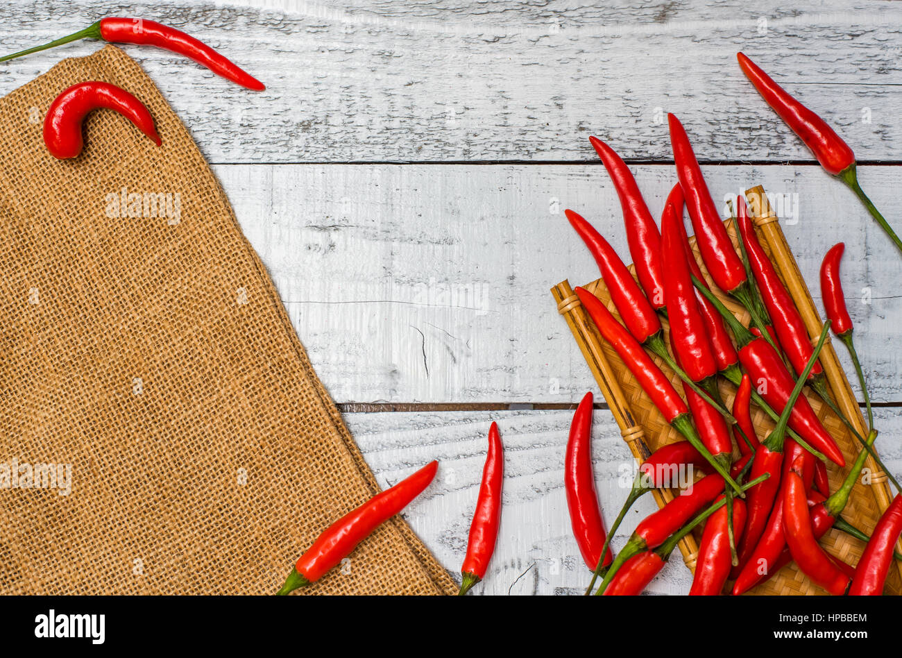 Hot and spicy red chilli on wood table background Stock Photo - Alamy