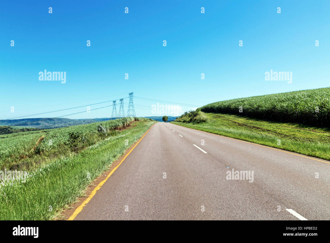 Rural Asphalt Road Curving Through Rural Landscape Stock Photo - Alamy