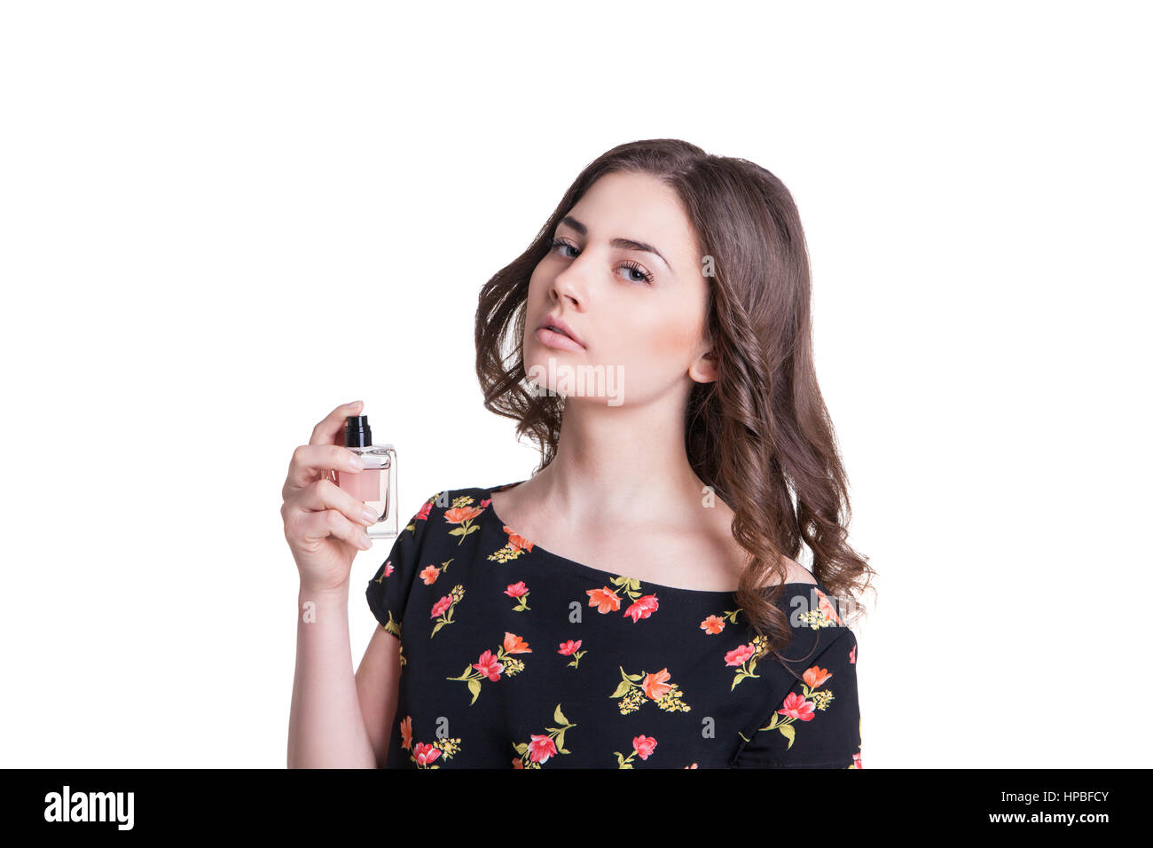 young woman spraying the perfume Stock Photo - Alamy