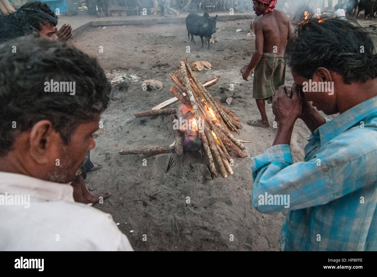 PURI, INDIA: The body of a man is being cremated in Swargadwar ...