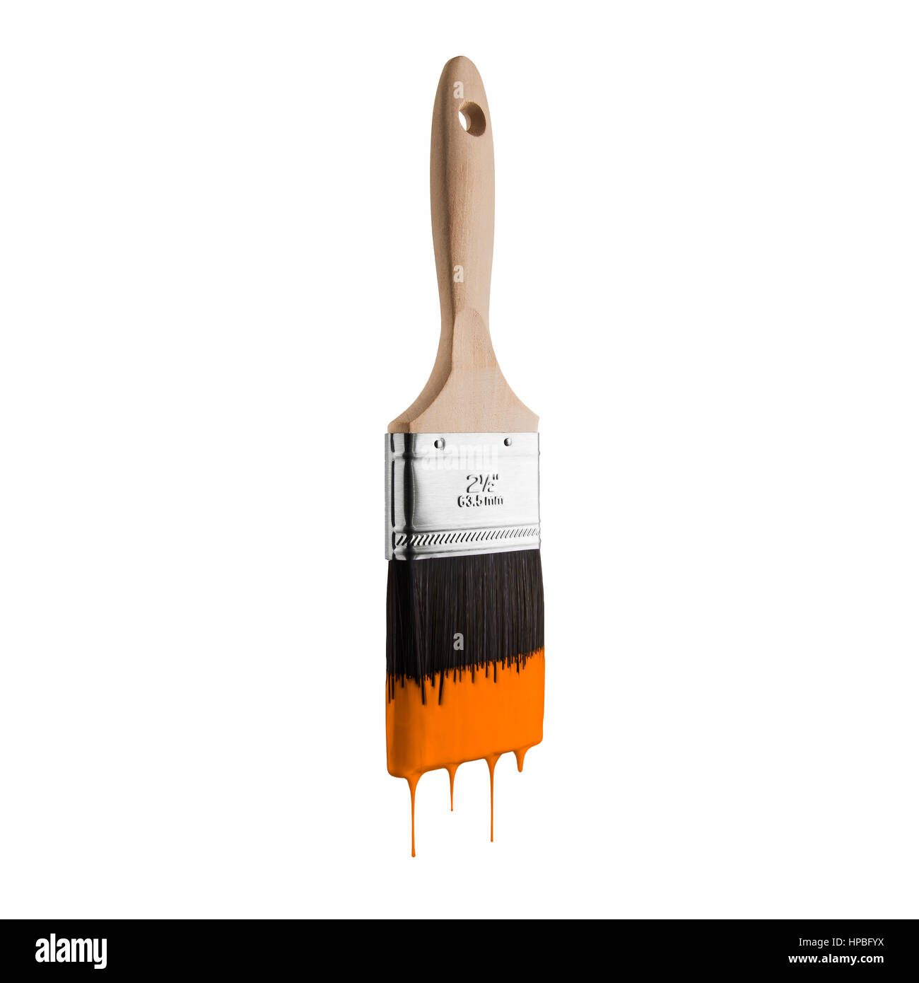 Paintbrush loaded with orange color dripping off the bristles. Isolated ...