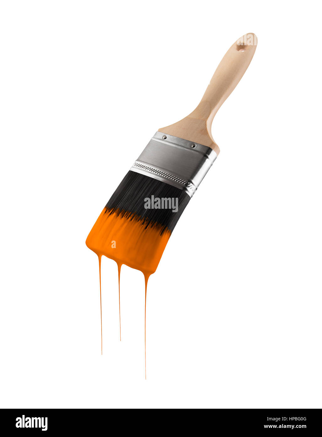 Paintbrush loaded with orange color dripping off the bristles. Isolated ...