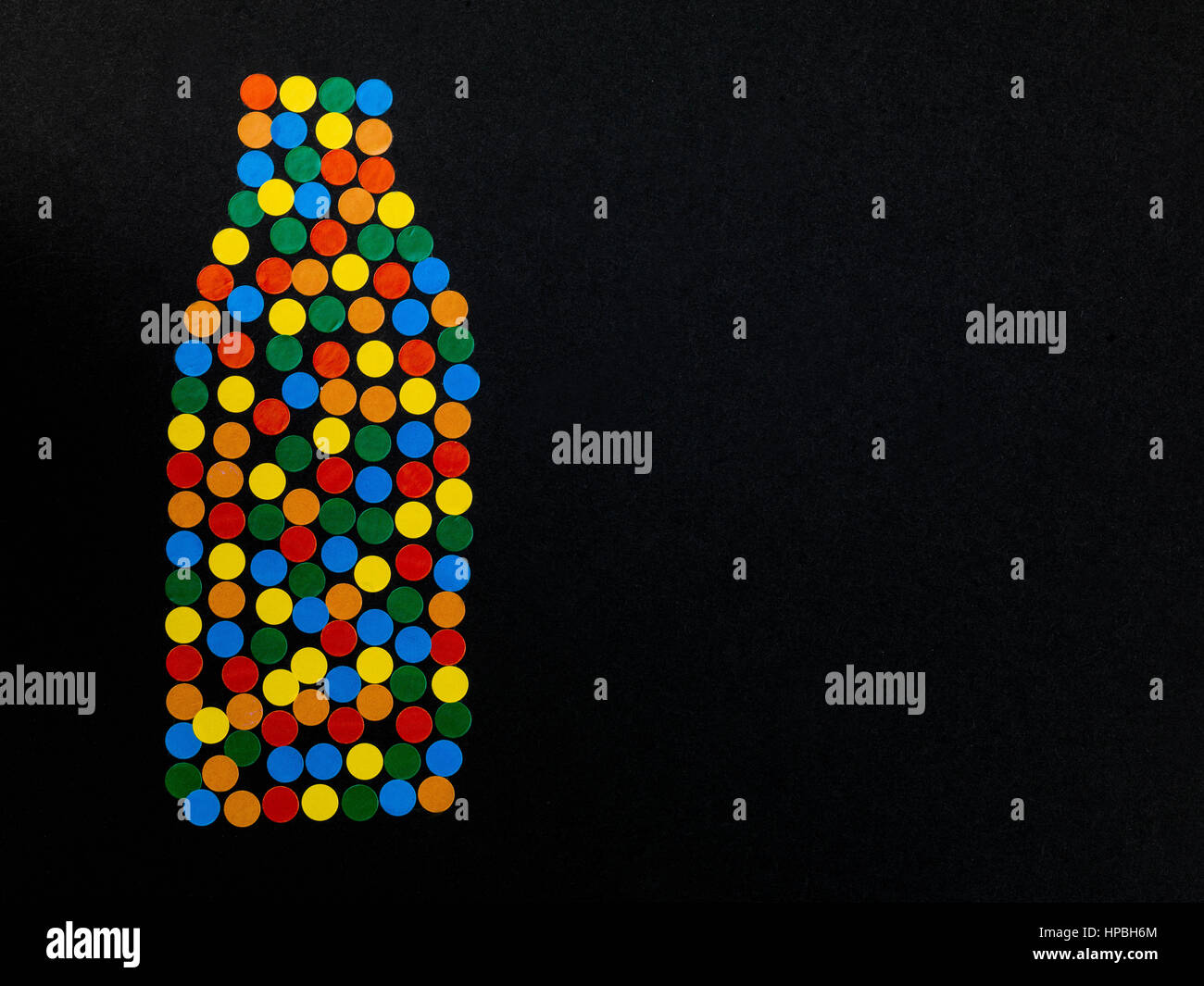 Colored Dots Making Shape of a Bottle Against a Black Background Stock ...