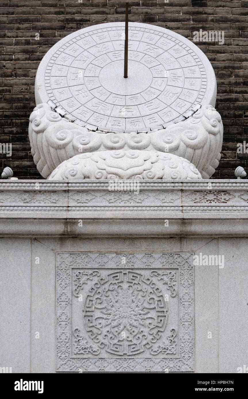 An ancient stone sundial located within the south gate area of the Xian ...