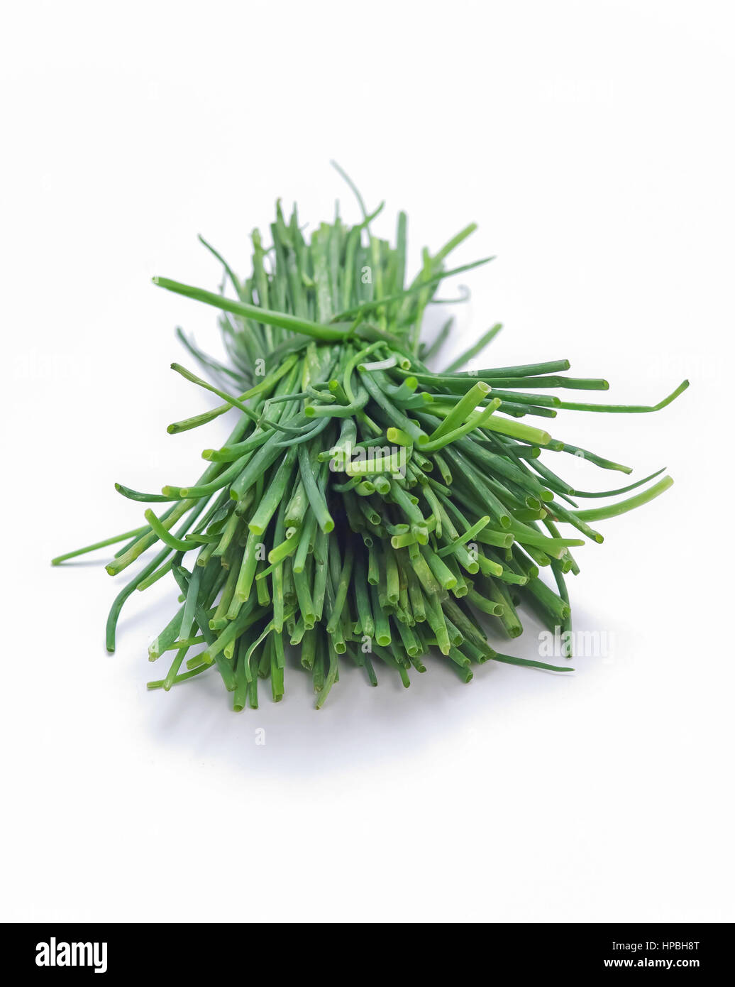 Bunch of fresh chives on white background Stock Photo - Alamy