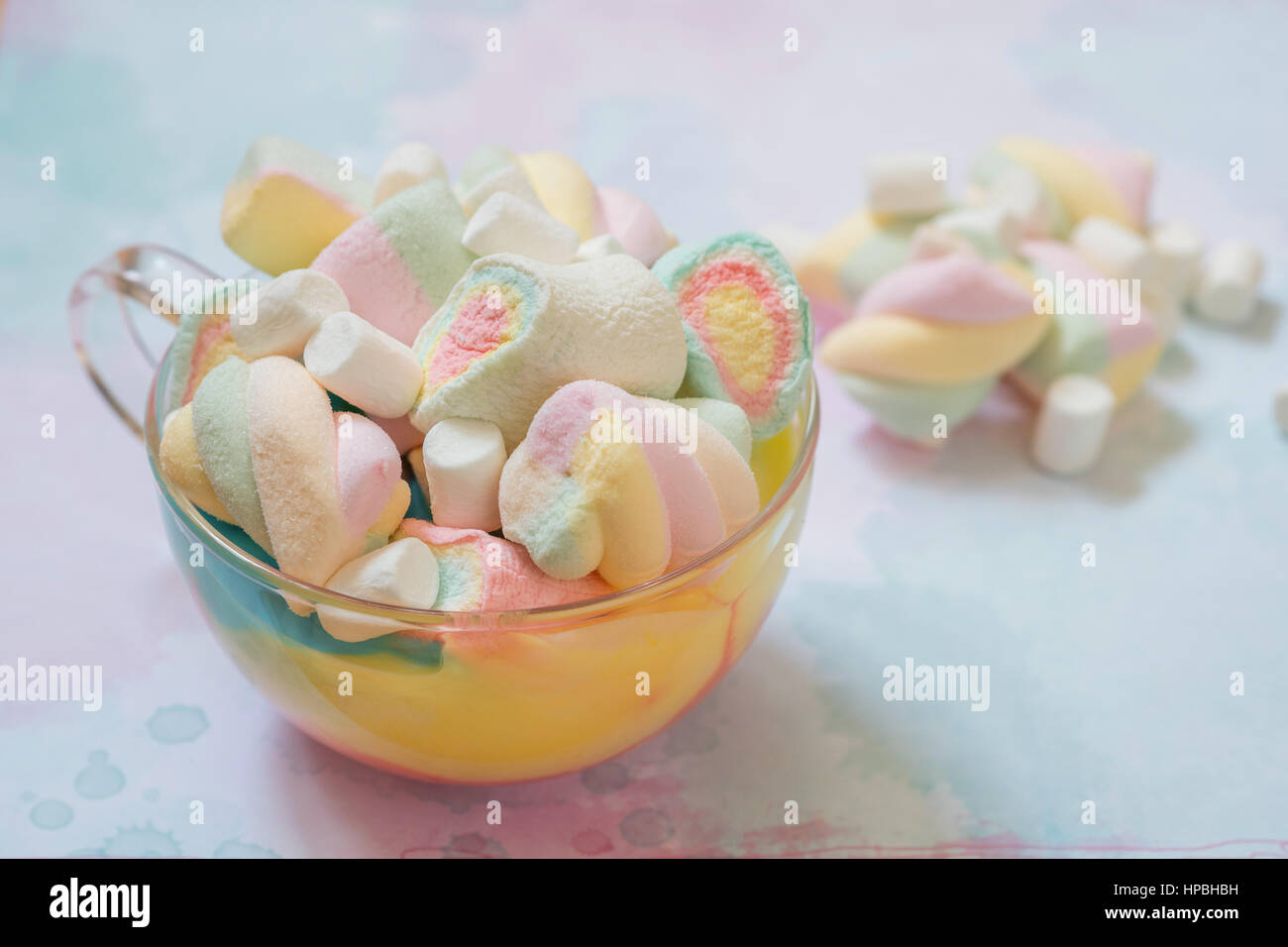 Rainbow hot chocolate with colorful marshmallow on a table Stock Photo ...