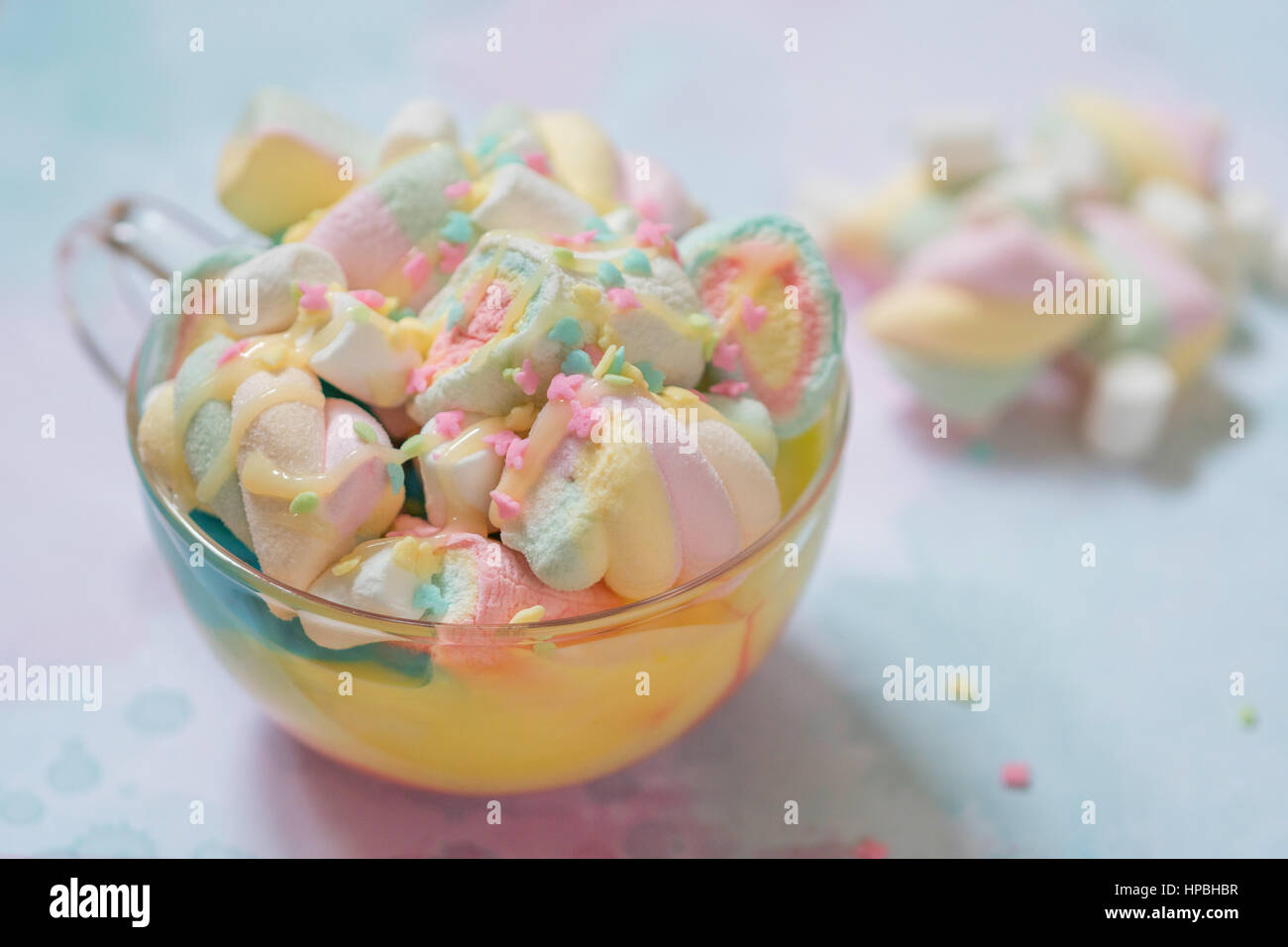 Rainbow hot chocolate with colorful marshmallow on a table Stock Photo ...