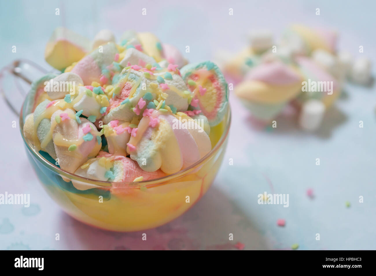 Rainbow hot chocolate with colorful marshmallow on a table Stock Photo ...