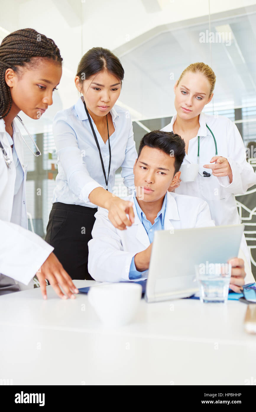 Students in medical school apprenticeship with tablet computer Stock ...
