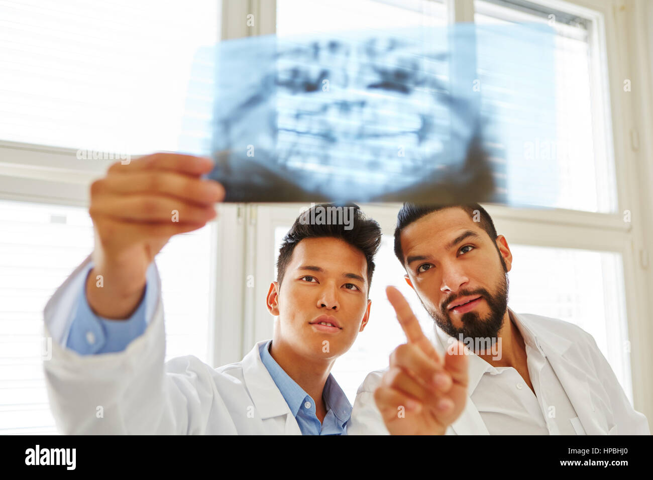 Two radiologists make x-ray image diagnose together in teamwork for ...