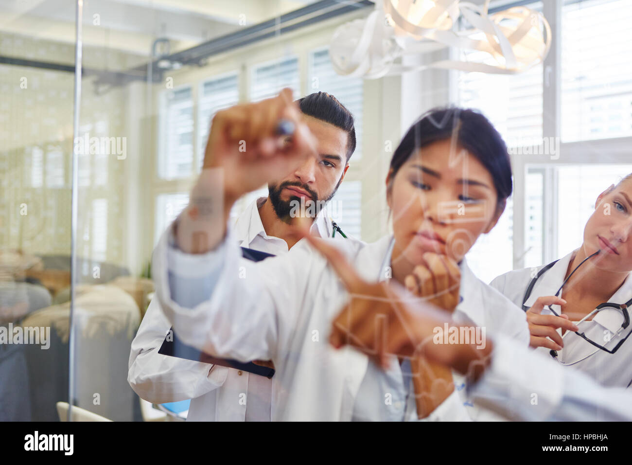 Medicine students in workshop working together and learning Stock Photo ...