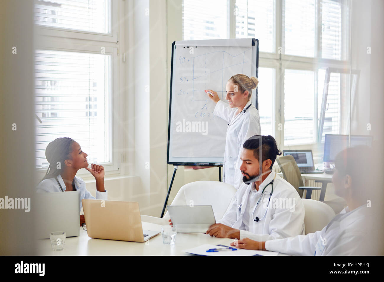 Doctors in medical seminar presentation for training Stock Photo - Alamy