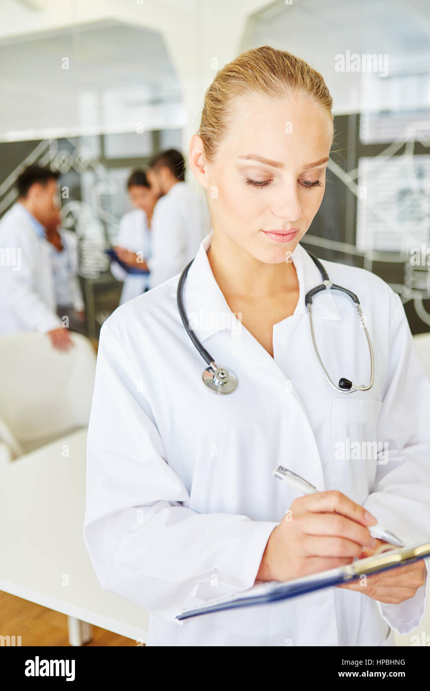 Nurse or doctor writing on patient record checklist therapy control ...