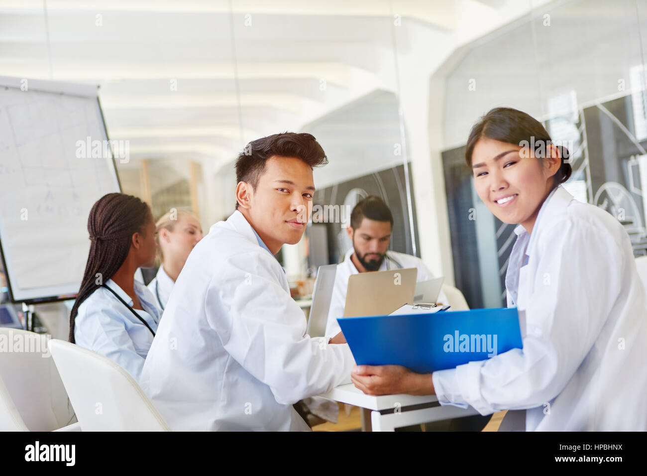 Students in medical school seminar learn together in cooperation Stock ...