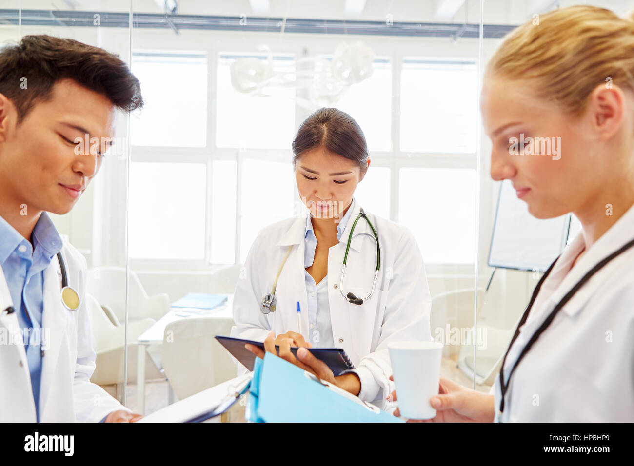 Medicine students studying in team during medical workshop Stock Photo ...