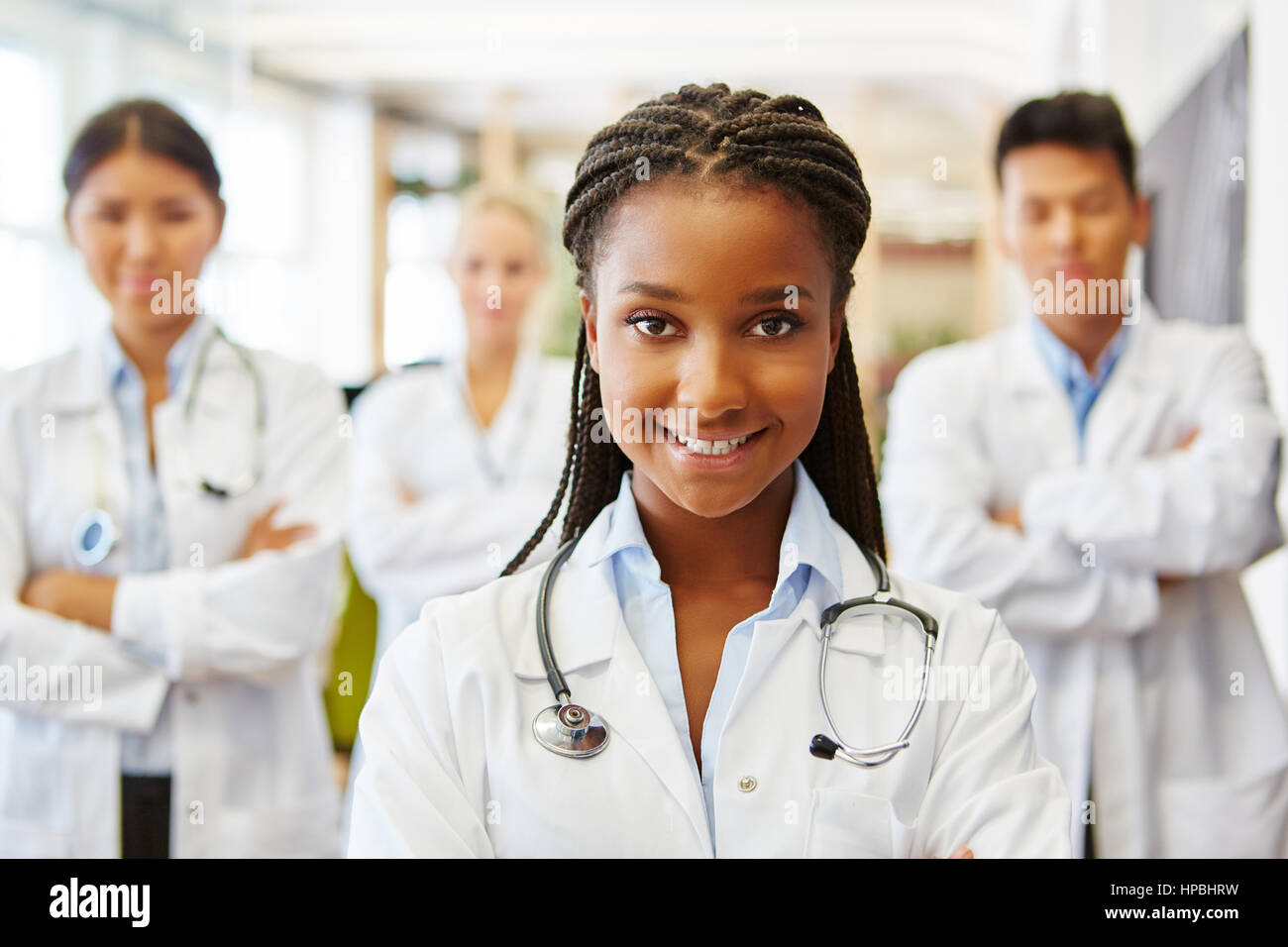 Young african nurse in medical apprenticeship smiling friendly Stock ...
