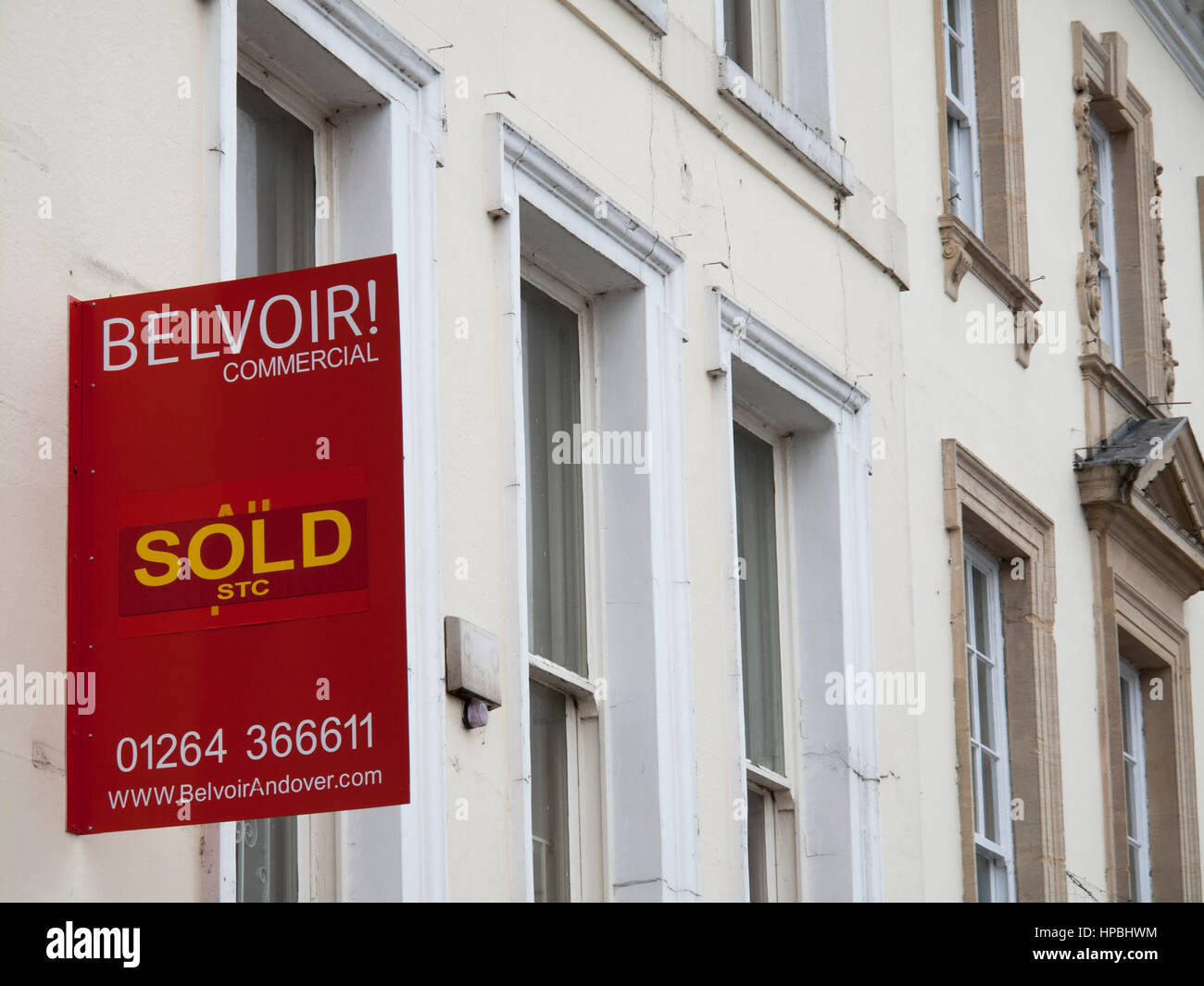 Commercial vacant shop sold sign over retail unit Stock Photo - Alamy