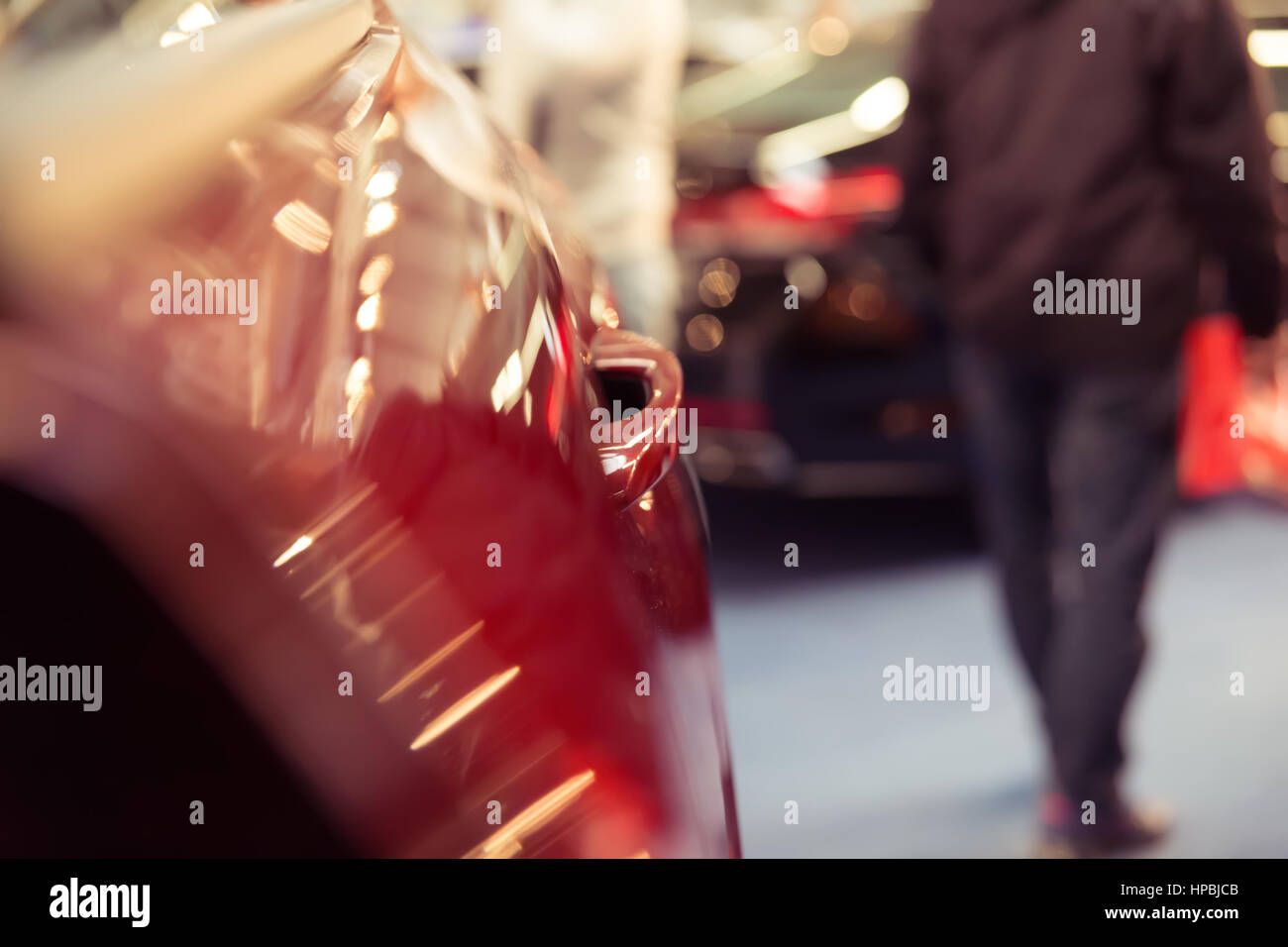 A glossy red painted car door with door edge,Color detail of a red car ...