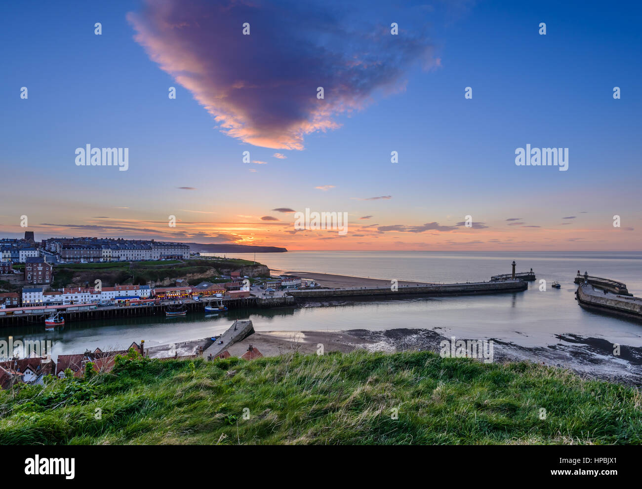 Whitby harbour and quayside viewed from the East Cliff at sunset Stock ...