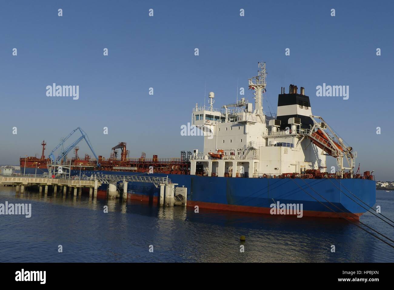 Products Tanker discharging at the Oil Terminal with blue hull and red ...