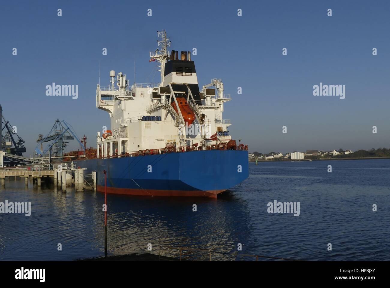 Products Tanker discharging at the Oil Terminal with blue hull and red ...