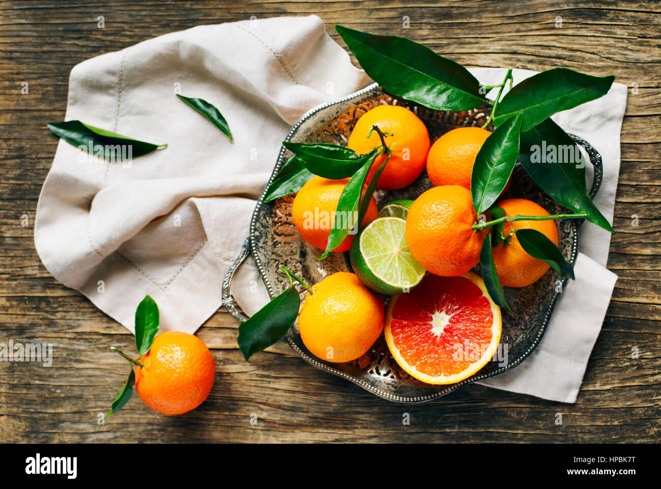 Fresh citrus fruits with leaves, top view Stock Photo - Alamy