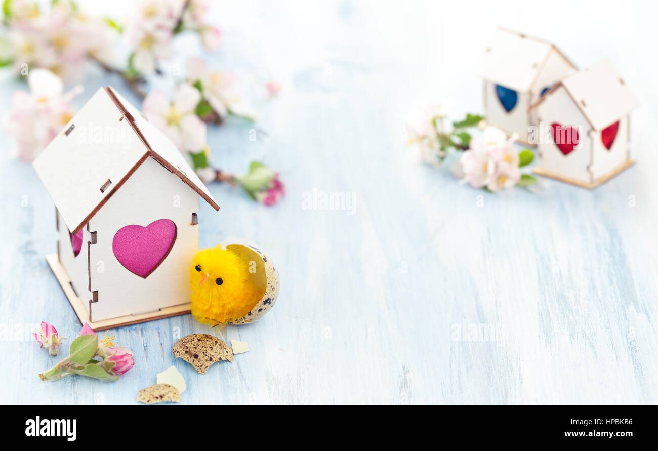 White Wood houses with colorful heart shaped windows Stock Photo - Alamy