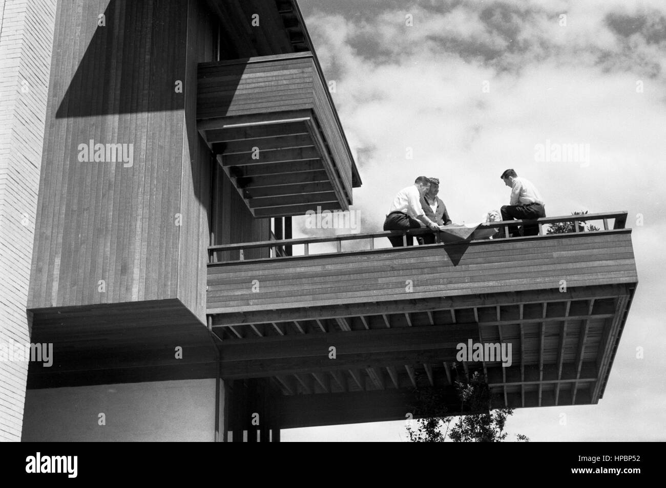 Architect Ralph Anderson, wearing sweater, in 1961 at a house he ...