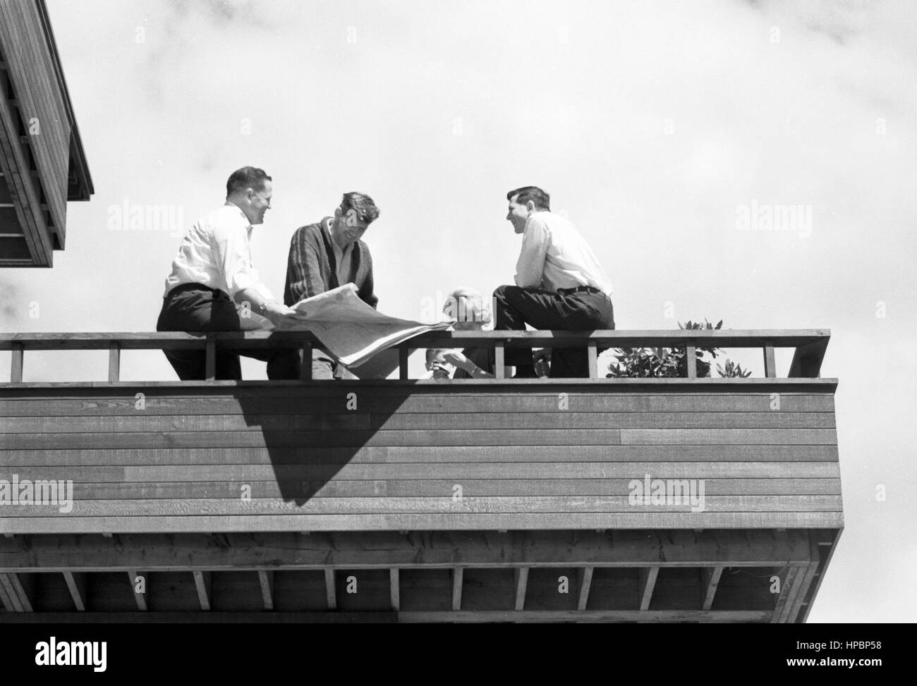 Architect Ralph Anderson, wearing sweater, in 1961 at a house he ...