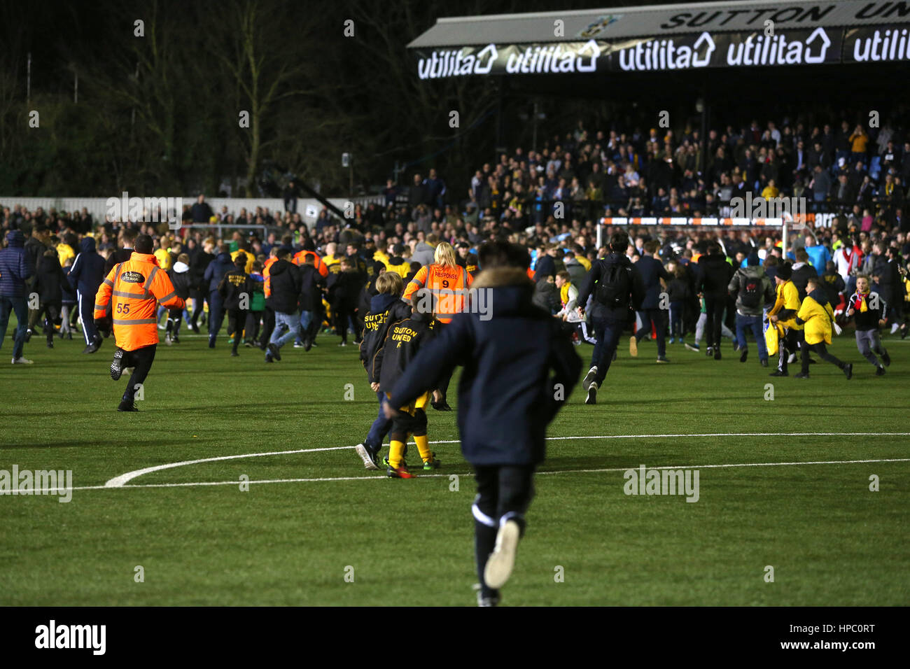 Sutton, UK. 20th Feb, 2017. The home fans invade the pitch at the end ...