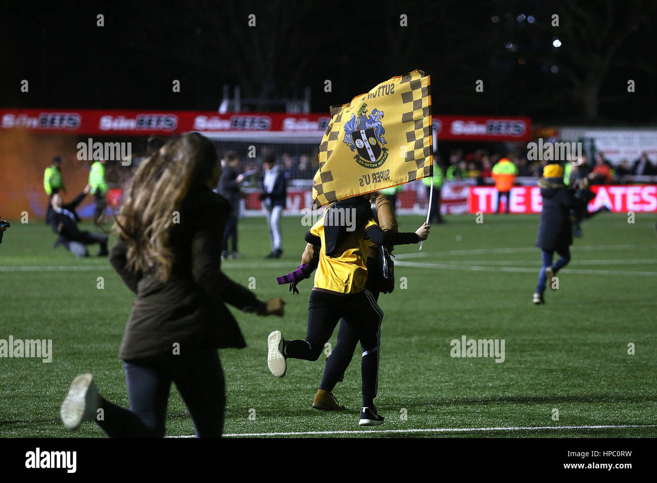 Sutton, UK. 20th Feb, 2017. The home fans invade the pitch at the end ...