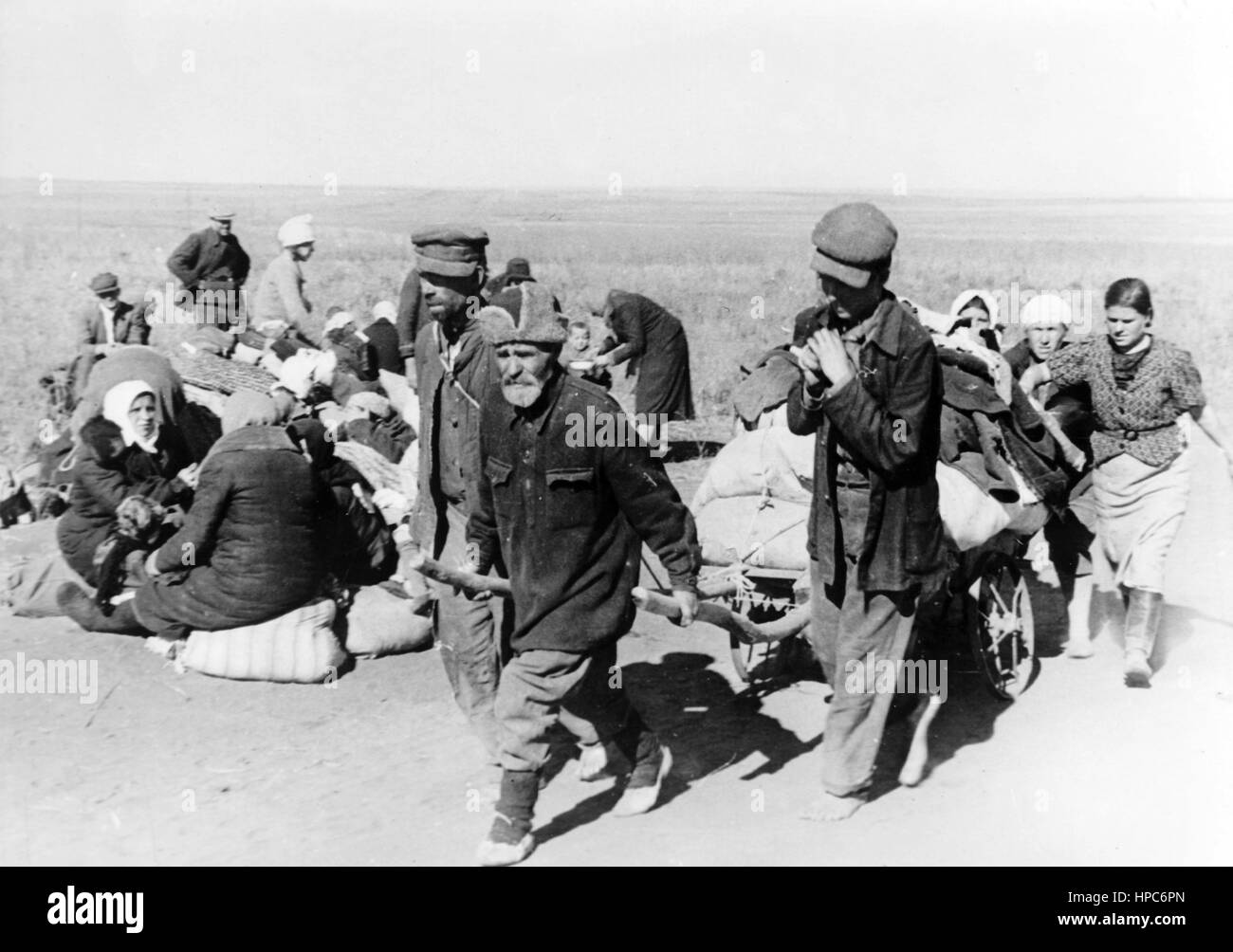 The Nazi propaganda image shows civilians with their belongings fleeing ...