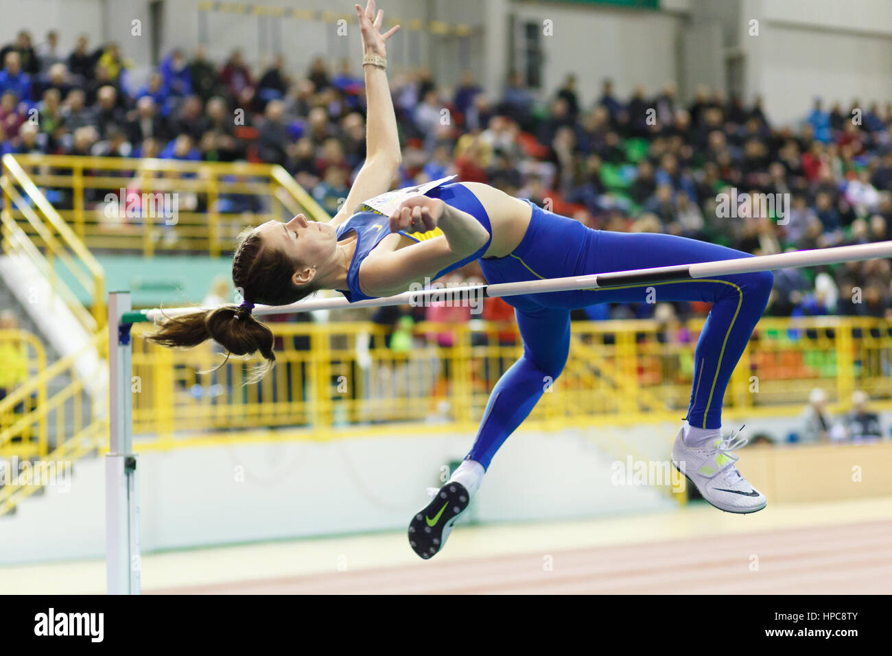 SUMY, UKRAINE - FEBRUARY 17, 2017: Yuliya Chumachenko jumping over bar ...