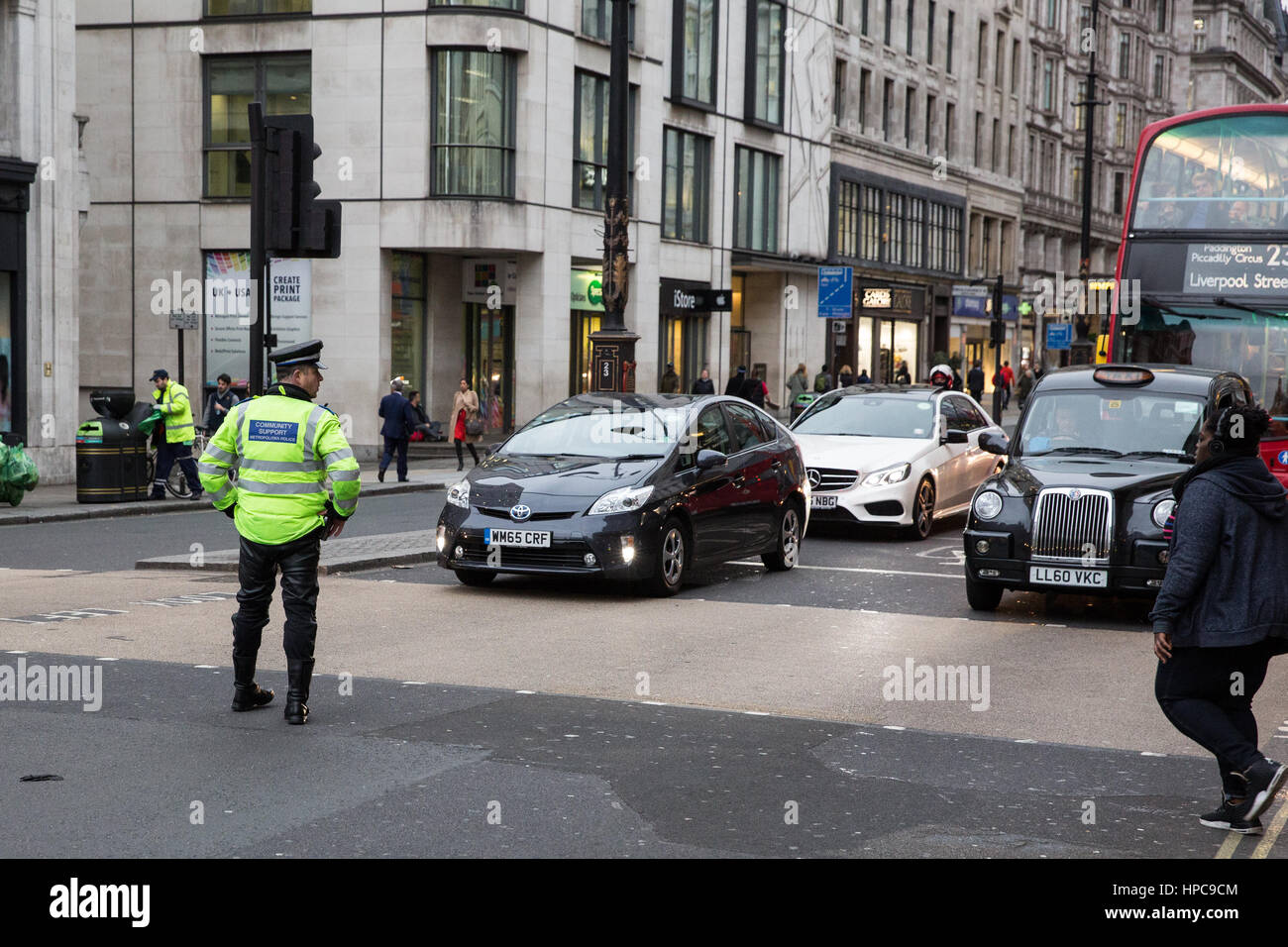 London, UK. 21st February, 2017. Police officers control traffic and ...