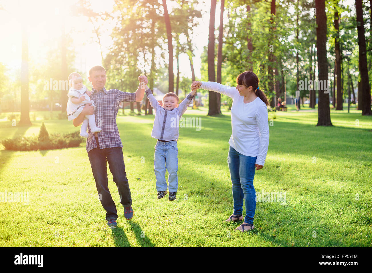 Father happy children in park hi-res stock photography and images - Alamy