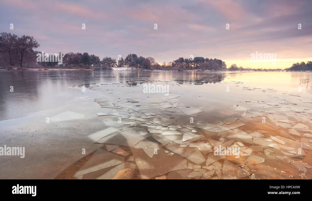 Autumn morning landscape. Thin broken ice on the lake Stock Photo - Alamy