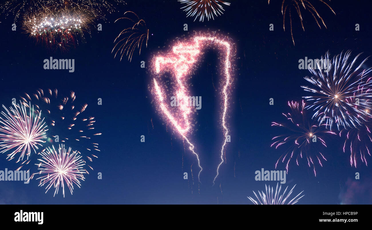 A dark night sky with a sparkling red firecracker in the shape of ...