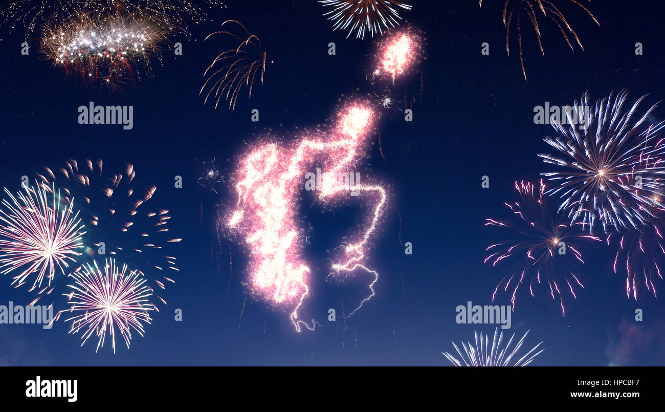 A dark night sky with a sparkling red firecracker in the shape of ...