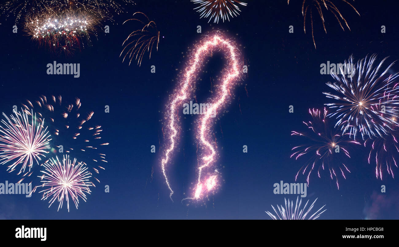 A dark night sky with a sparkling red firecracker in the shape of ...