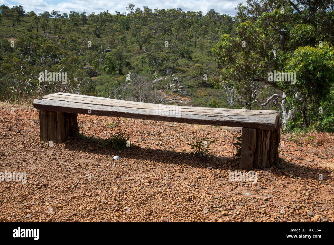 A wooden bench looking at forest landscape background in John Forrest ...
