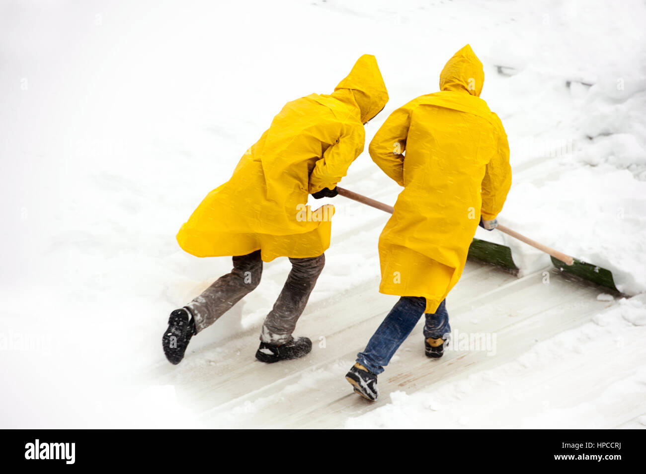 Men shoveling the snow Stock Photo - Alamy